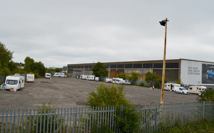 Irish travellers set up large camp on BMW and MINI factory site in Swindon