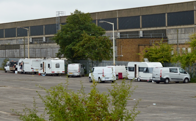 Irish travellers set up large camp on BMW and MINI factory site in Swindon