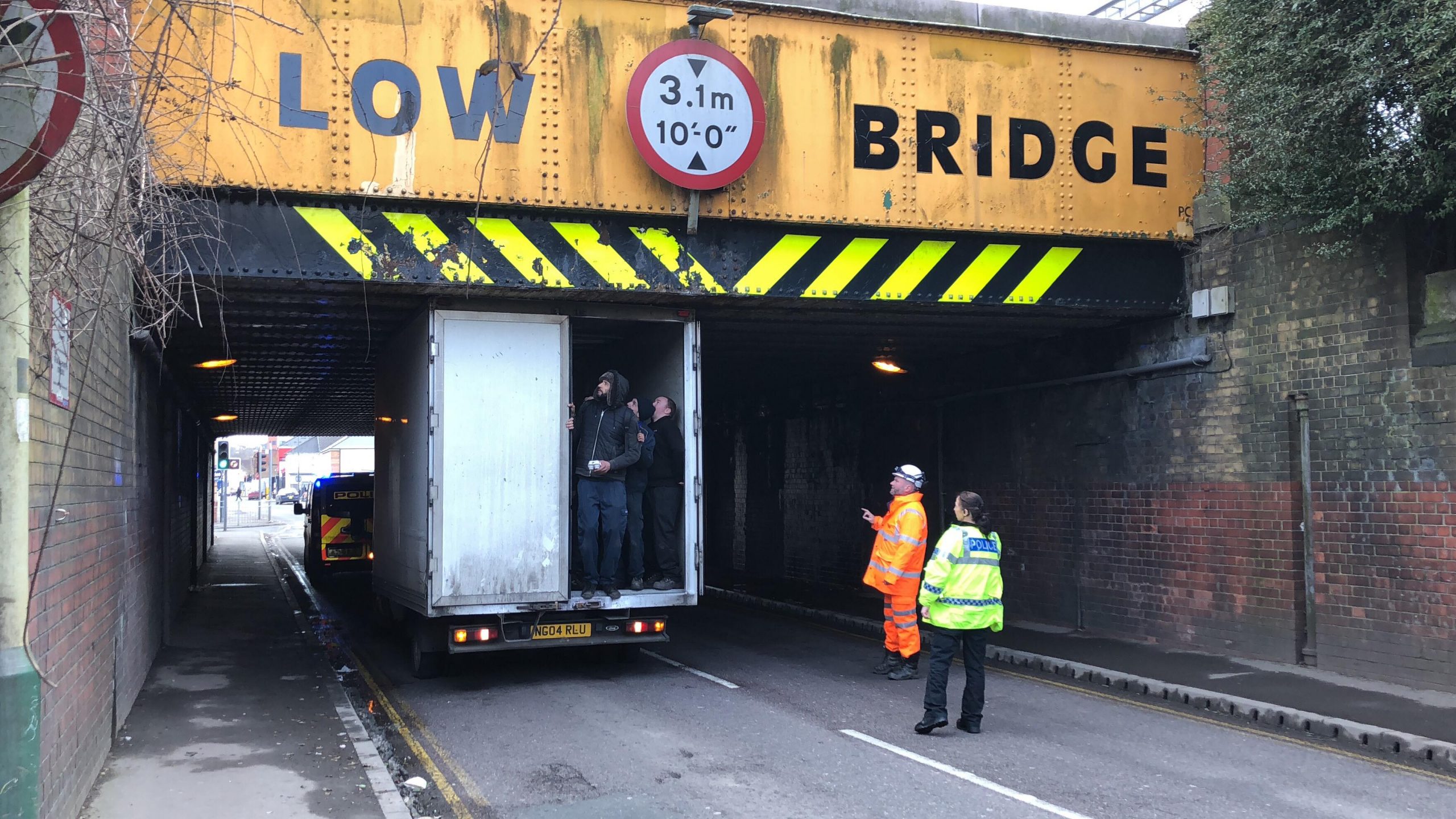Road closed as charity van becomes wedged under Swindon town centre bridge