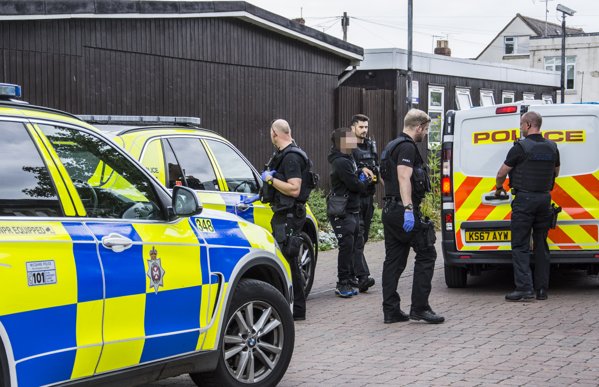 Armed police swarm street and make arrests after assault in Swindon