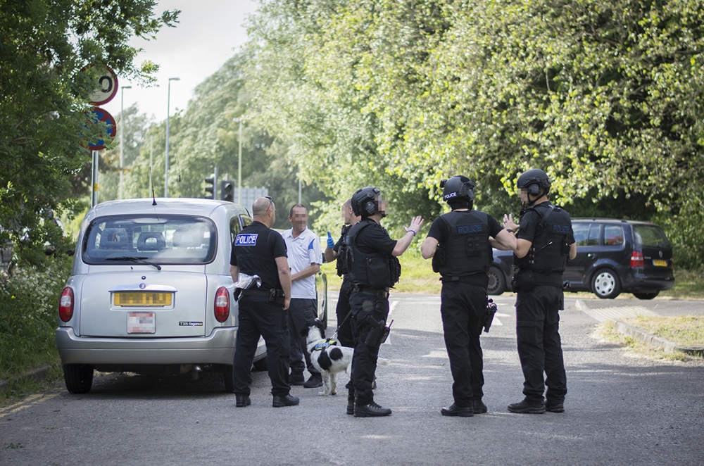 Armed police detain men at gunpoint on roundabout near Coate Water