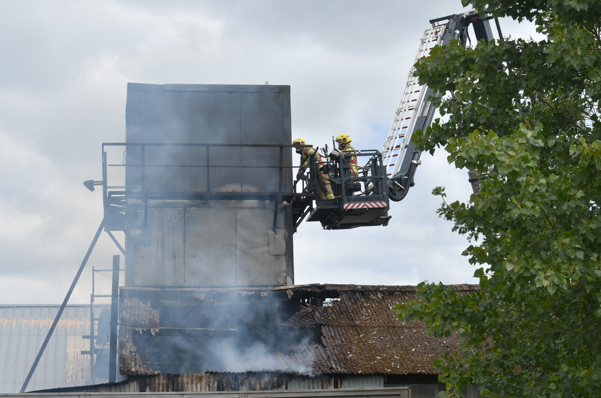 Ten fire engines attending blaze at timber yard in village near Calne