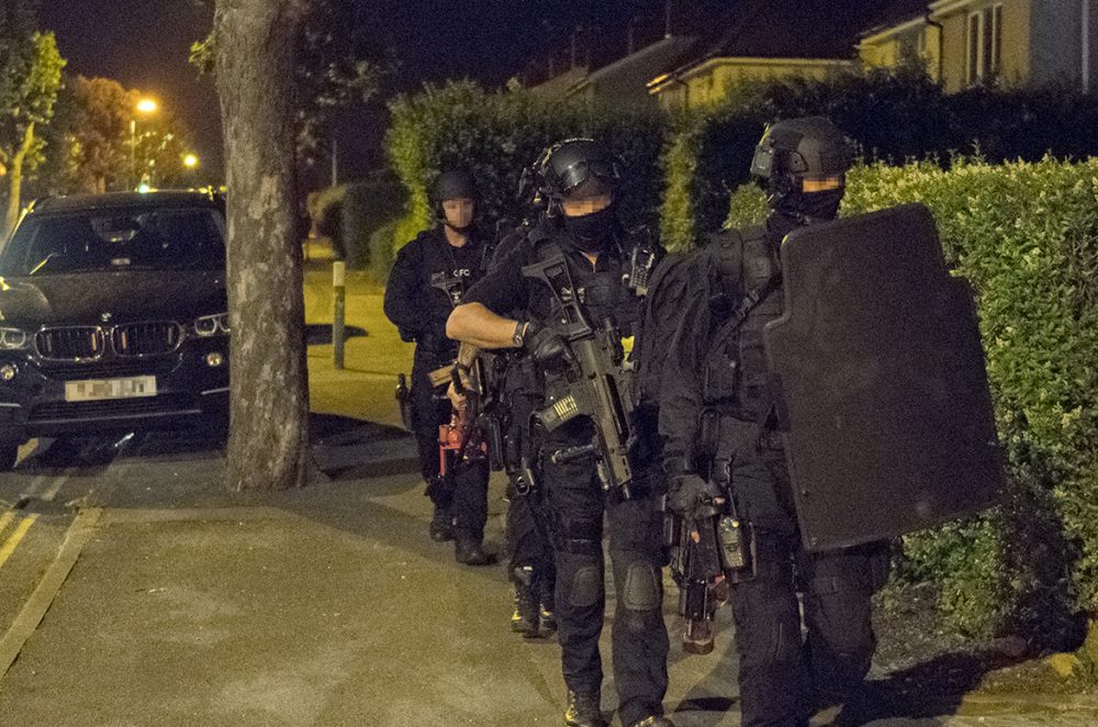 Armed police raid house after crime scene put in place around car in ...