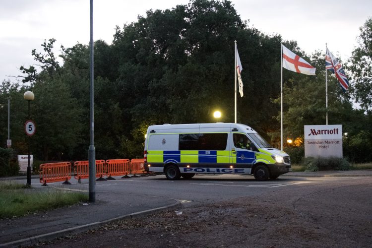 Riot vans patrol Swindon as businesses take security measures ahead of rave