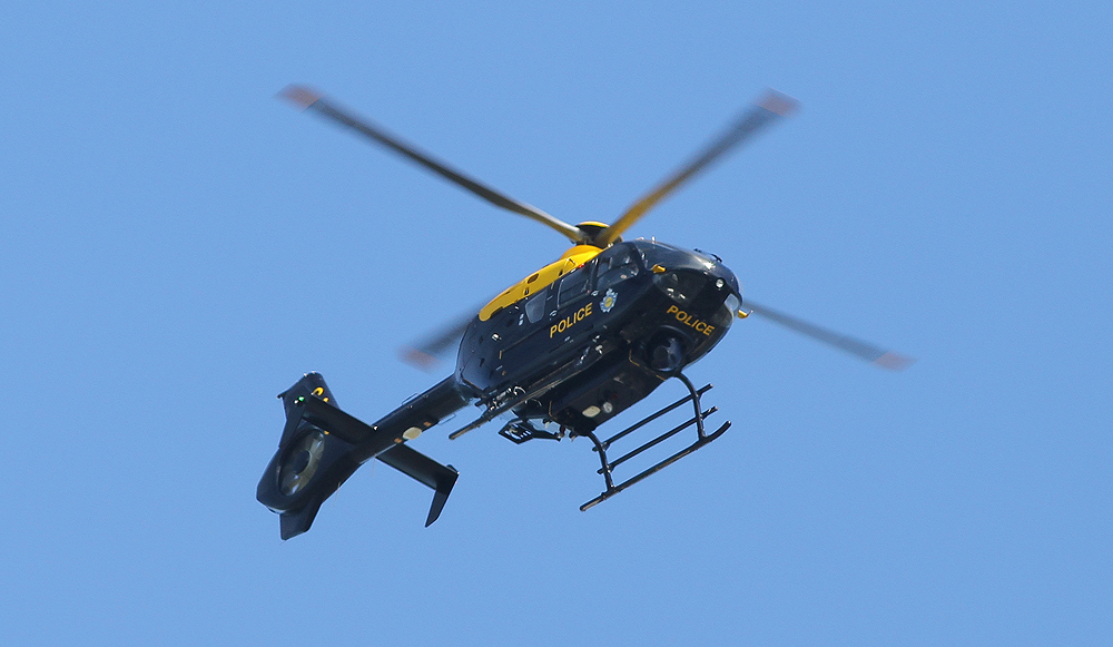 Police detain man at gunpoint after sighting of weapon being carried in ...