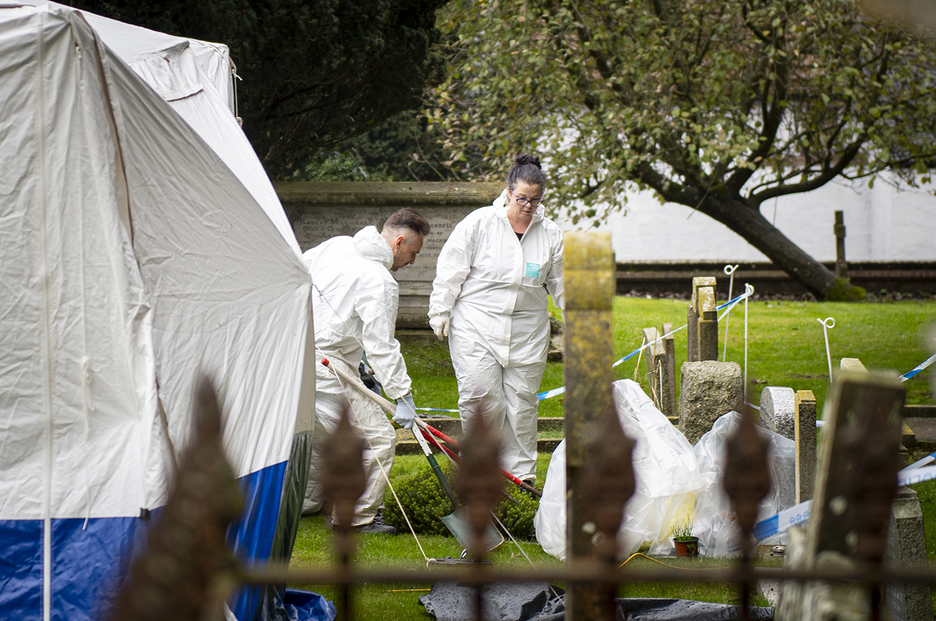 Forensics seen 'digging up graves' as Wiltshire Police dispel village ...