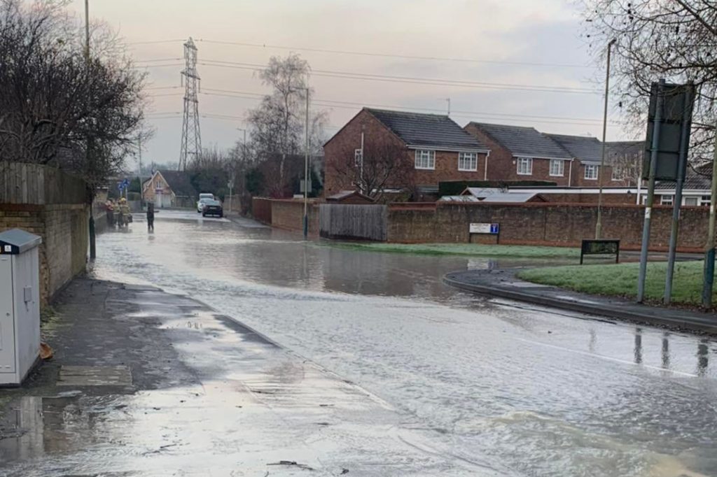 Police close Swindon road after burst water main causes major flooding