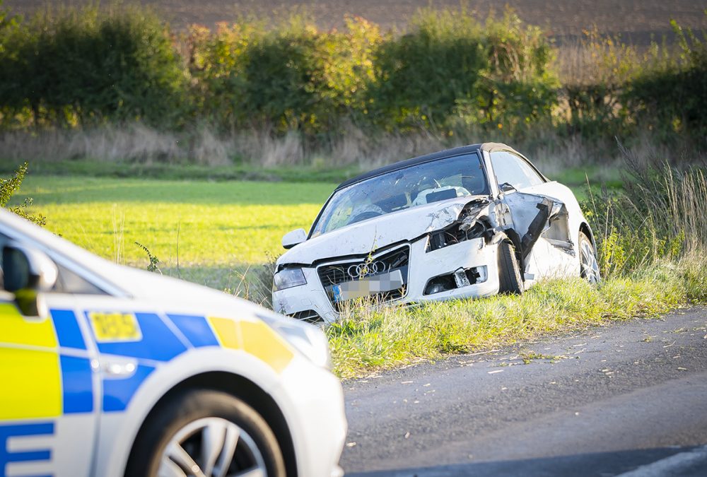 A-road partially blocked after car leaves carriageway and crashes into tree