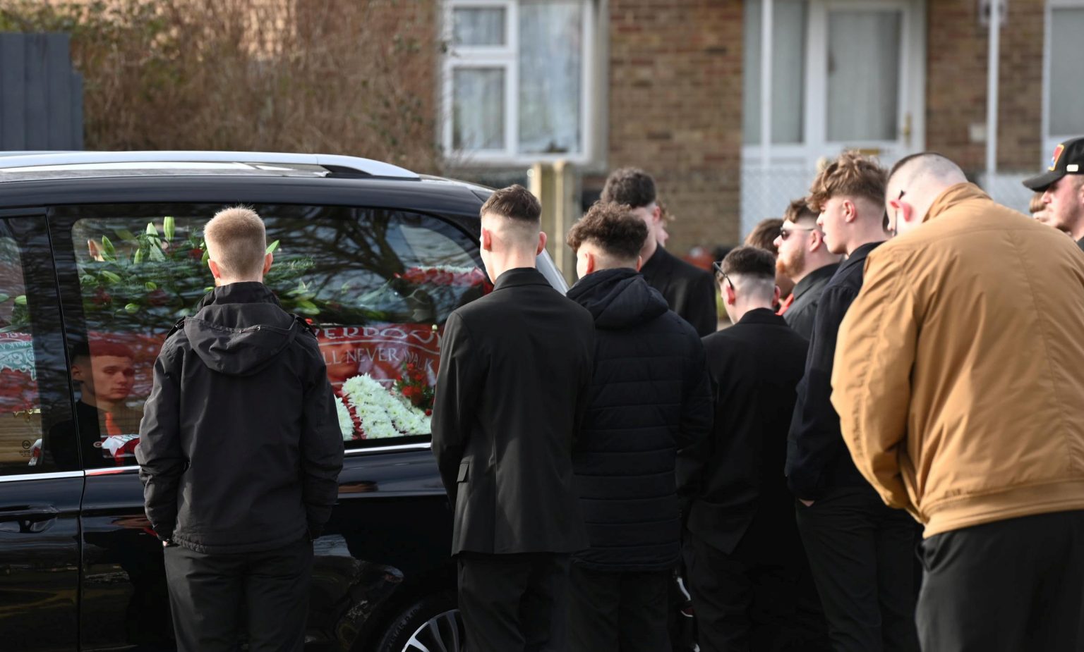 Hundreds of mourners line Swindon streets to say final goodbye to Owen Dunn