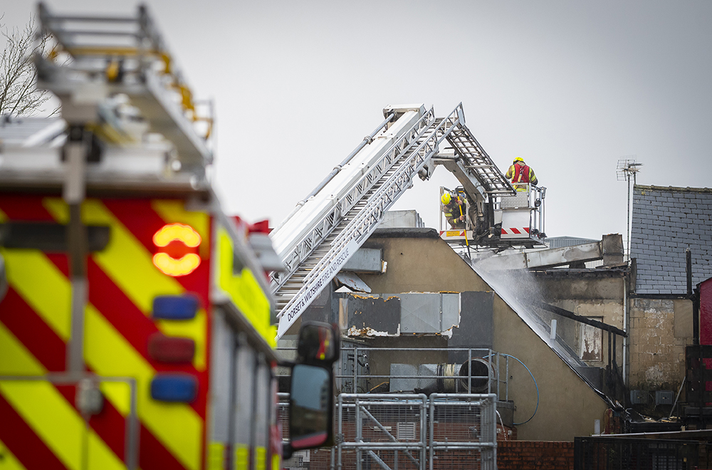 Firefighters continue to battle Swindon town centre blaze ten hours on