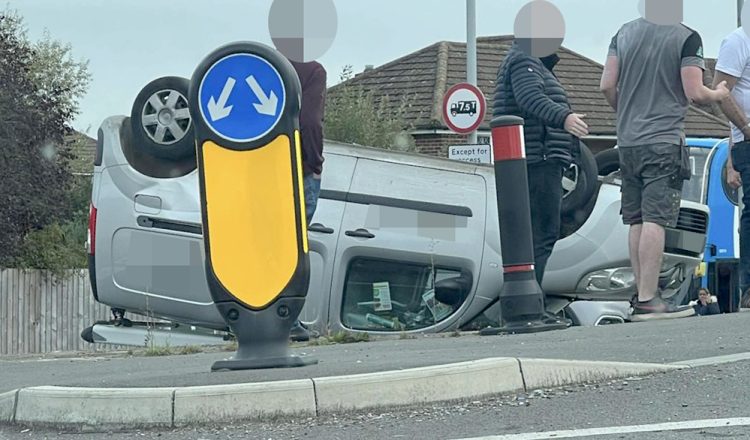 Van overturns in dramatic crash on roundabout outside Swindon pub