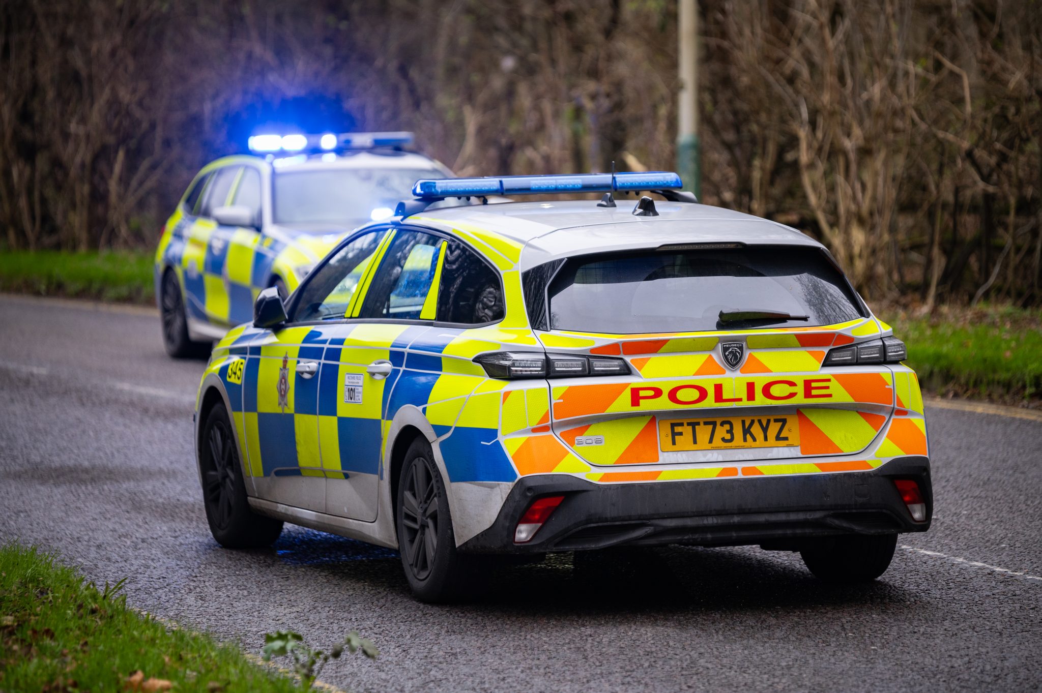 Vehicles crash on M4 junction as police car responds on blue lights