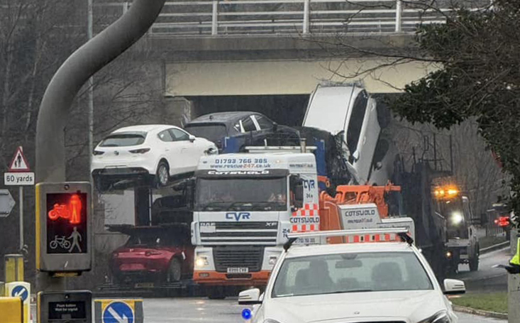 Car transporter hits Swindon bridge as road closed by police