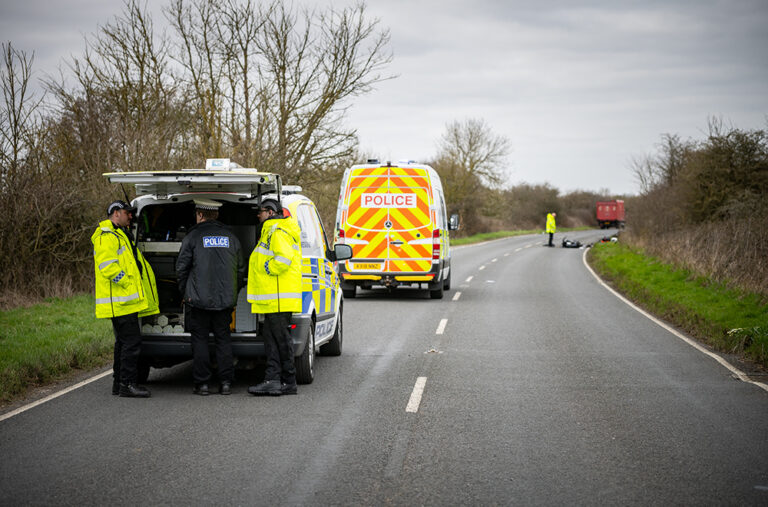 Biker 'attempting overtake crashed into Royal Mail lorry', police say