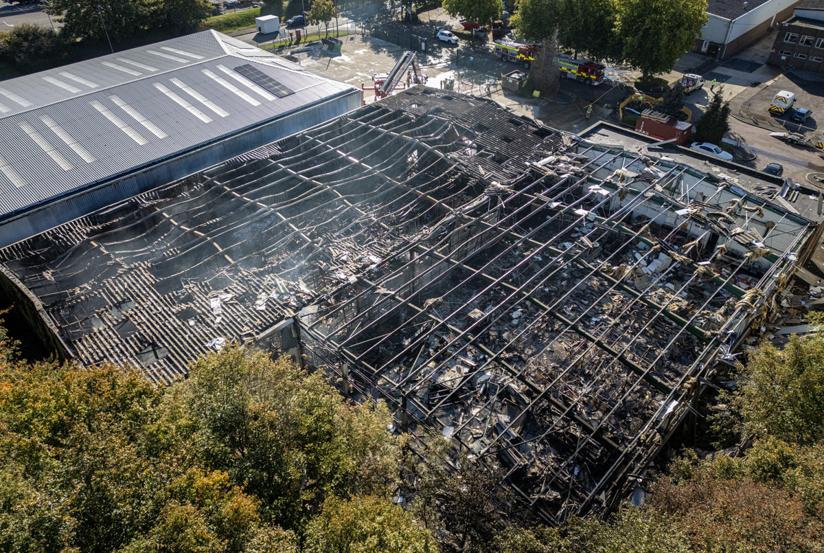 Firefighters still tackling burning remains of building after explosion