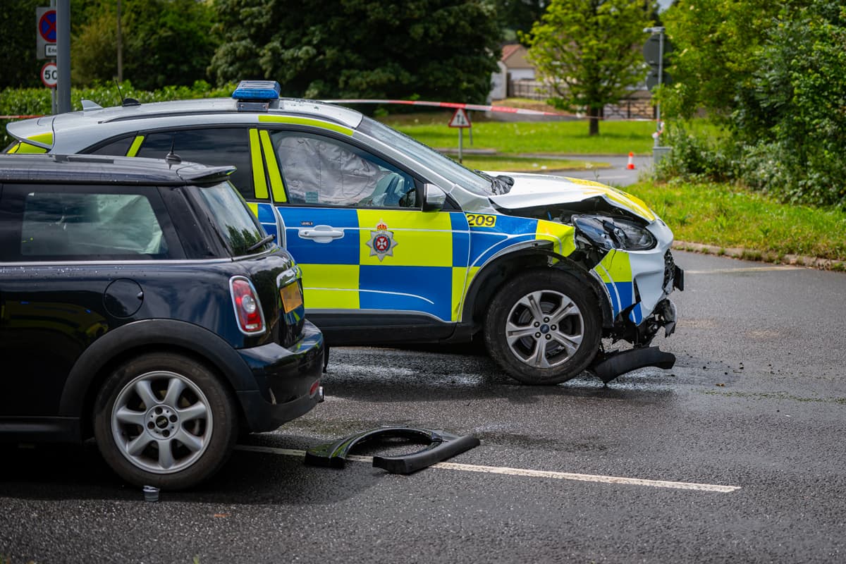 Woman in hospital after Mini hit by police car responding to 999 call