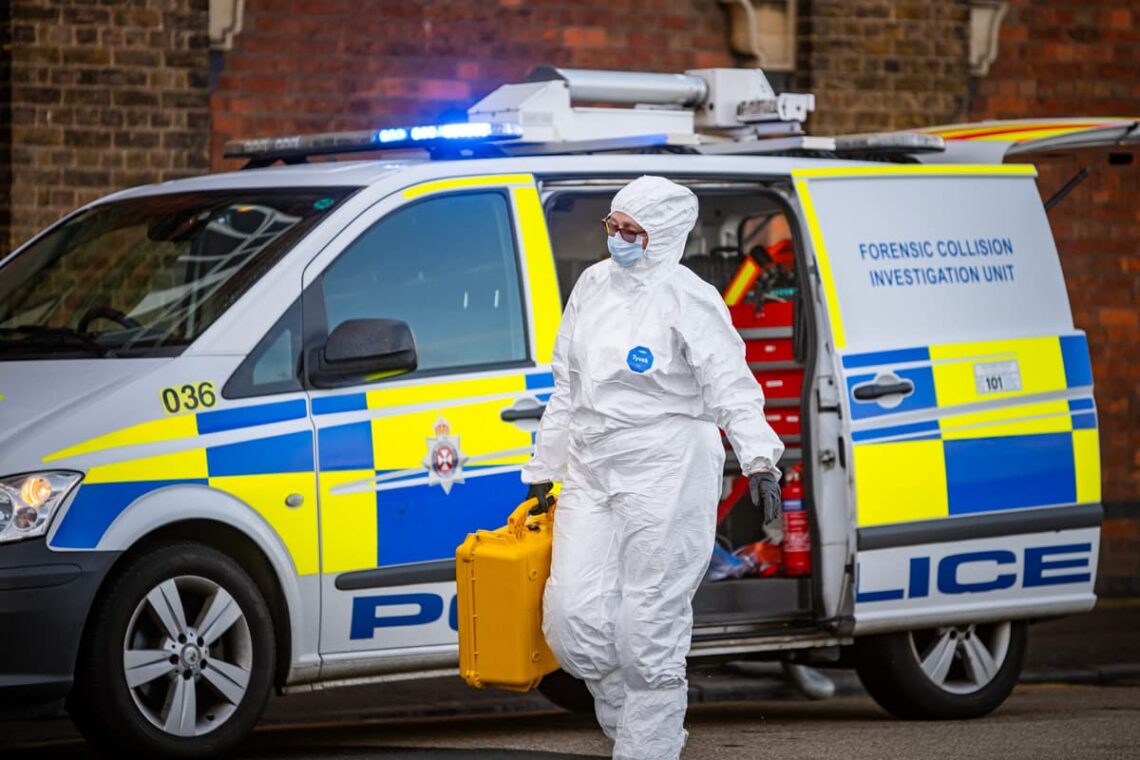 Forensics examine car in alleyway following hit-and-run in Swindon